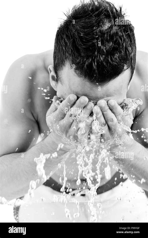 Young Man Washing Face With Clean Water And Representing Hygiene And