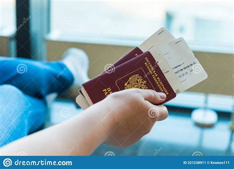 Closeup Of Female Holding Passports And Boarding Pass Stock Image
