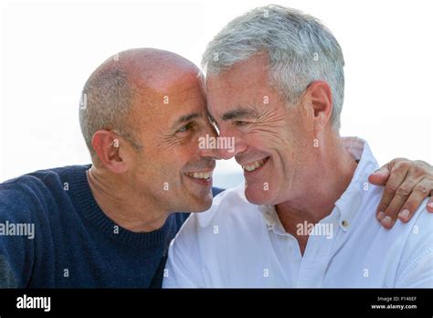 Senior Gay Male Couple Smiling And Affectionate In Love And On
