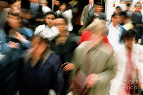 stress blurred effect of office workers commuting photograph by conor