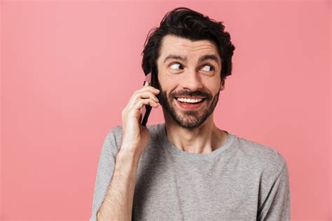 Premium Photo Handsome Excited Young Bearded Brunette Man Wearing