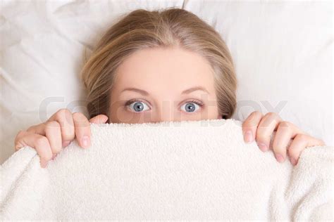 Funny Young Woman Lying In Bed Under Blanket Stock Image Colourbox