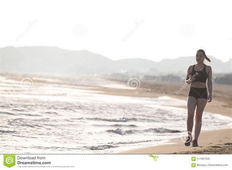 Healthy Young Fitness Woman Runner Running On Sunrise Seaside Tr Stock