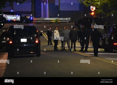 Investigators Gather Clues At The Scene Of The Crime Four People