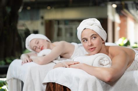 Premium Photo A Portrait Of A Couple Of Attractive Young Woman Lie On