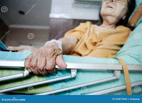 Sick Southeast Asian Female Senior Patient With Respiratory Disorder