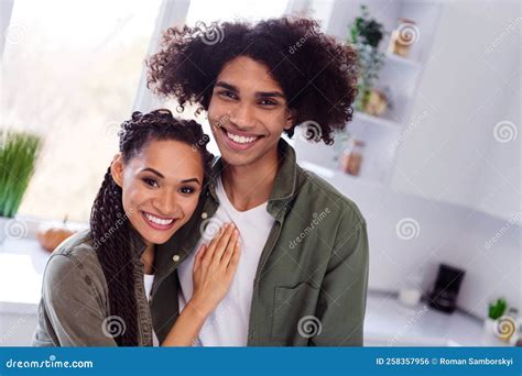 Portrait Of Two Cheerful Satisfied People Embrace Toothy Beaming Smile