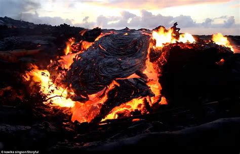 hawaii volcano appears to show off a red hot grin complete with glowing