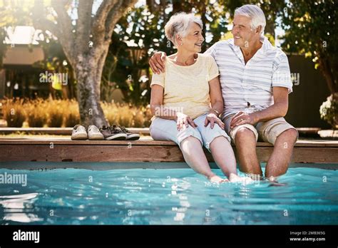 Senior Couple Hug And Swimming Pool For Holiday In Relax For Love Or