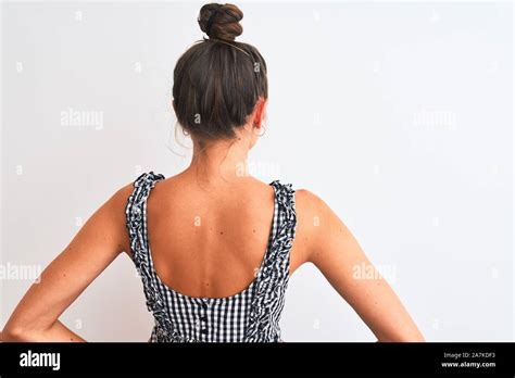 Beautiful Woman With Bun Wearing Casual Dresss Standing Over Isolated