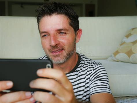 Lifestyle Home Portrait Of Young Happy And Attractive 30s Man Using