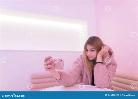 Pretty Girl In The Dress Makes The Pink Selfie On The Pink Phone In A
