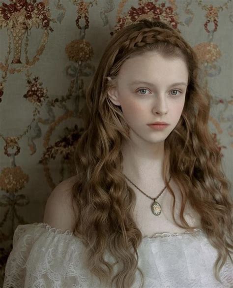 A Woman With Long Hair Wearing A White Dress