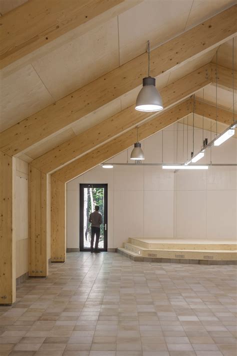 angular brick clad theatre by reset architecture sits in a woodland