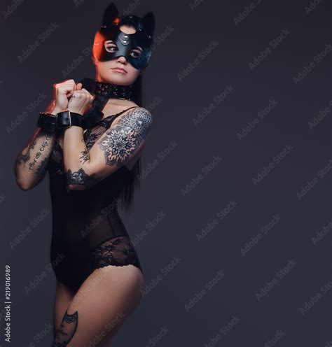 Sexy Woman Wearing Black Lingerie In Bdsm Cat Leather Mask And