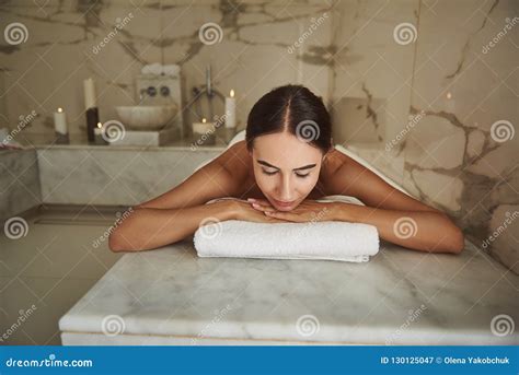Calm Lady Closing Her Eyes While Relaxing In Amazing Hammam Stock Image