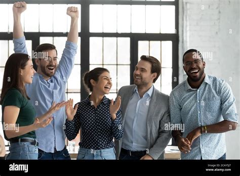 Overjoyed Happy Diverse Business Team Celebrating Success Together