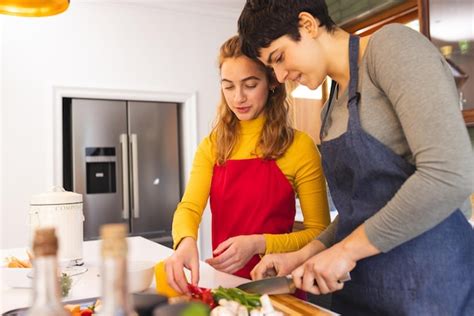 Premium Photo Happy Biracial Lesbian Couple Cooking Preparing