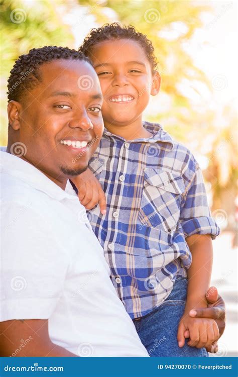 Mixed Race Son And African American Father Playing Outdoors Together