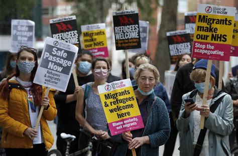 Protestors Hold Placards During A Pro Migrants Protest In London Rci