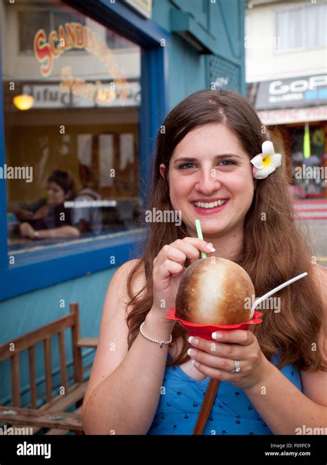 A Pretty Brunette Girl Enjoys A Hawaiian Shave Ice Shaved Ice From