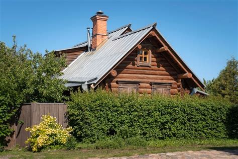 Premium Photo Traditional Russian Wooden Log House On A Sunny Summer