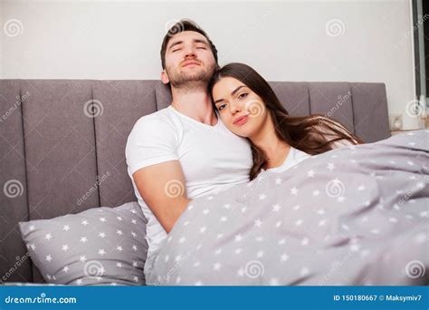Happy Couple Having Fun In Bed Young Couple In Bedroom Enjoying Each
