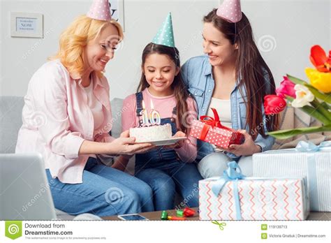 Grandmother Mother And Daughter Together At Home Birthday Sitting Women