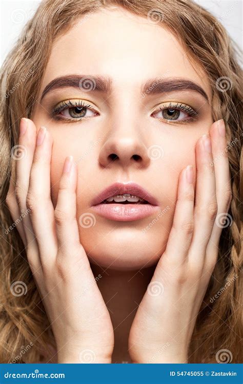 Portrait Of Beautiful Young Girl With Hands On The Face Stock Image
