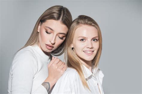 Portrait Of Two Cheerful Young Women Two Beautiful Young Women With
