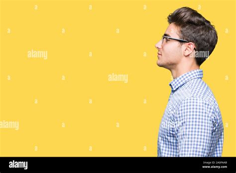 Young Handsome Man Wearing Glasses Over Isolated Background Looking To