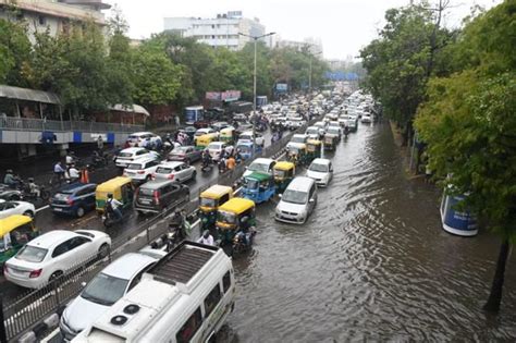 Heavy Rain Pounds Delhi As Monsoon Arrives Waterlogging Traffic