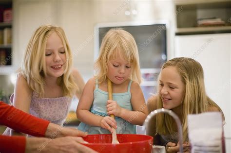 Sisters Cooking Together In Kitchen Stock Image F004 3367 Science