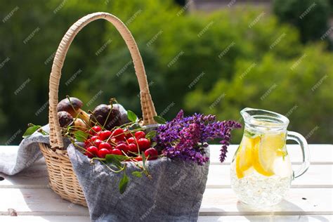 Premium Photo Porcini Mushrooms And Cherry Berries In A Basket Harvesting