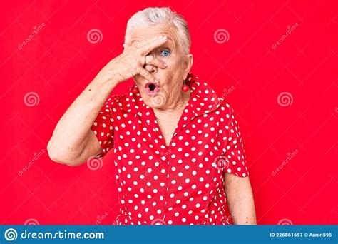 Senior Beautiful Woman With Blue Eyes And Grey Hair Wearing Casual