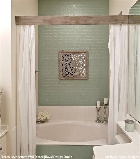 A Bath Tub Sitting Under A Bathroom Window Next To A White Sink And