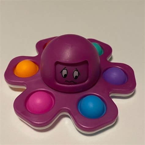 ハンドスピナープッシュポップ パープル 顔変化 タコさん メルカリshops