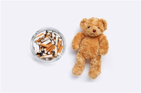 Premium Photo Brown Teddy Bear With Cigarette Butts And Ashes On