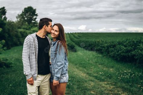 Young Loving Couple Woman And Man Gently Hugging With Eyes Closed On