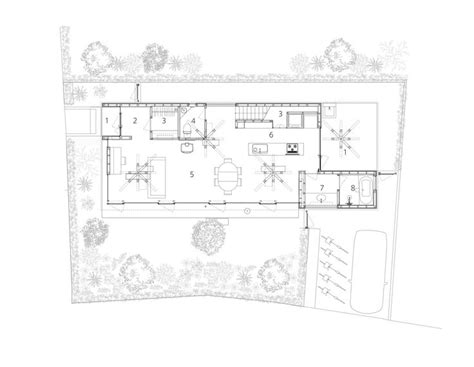 The Floor Plan For This Modern House Is Drawn In Black And White With