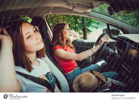 Front View Through Windshield Of Women Traveling In Camper Van A