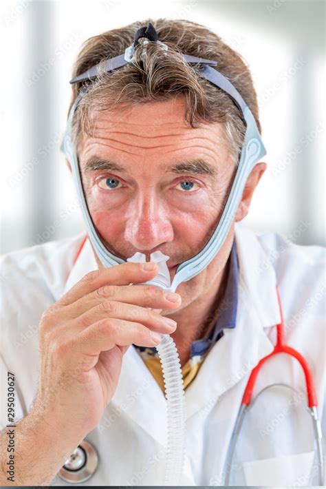 Doctor Demonstrating Treatment Of Sleep Apnea And Snoring For Patient