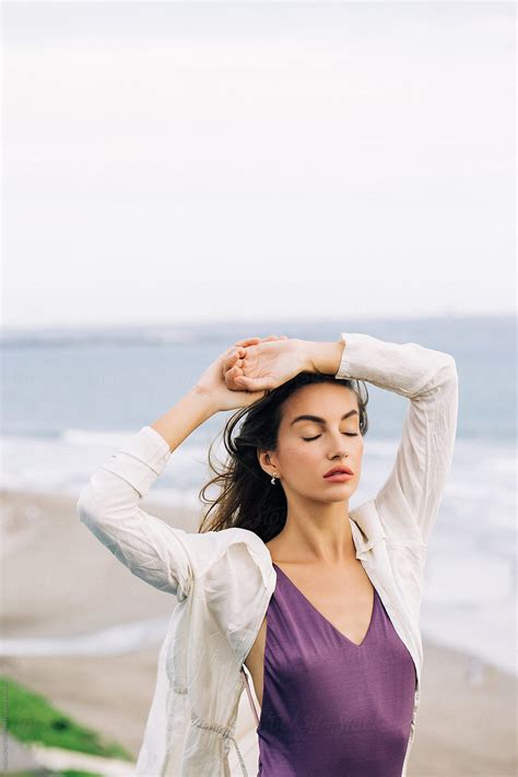 «beautiful Caucasian Woman Posing With Closed Eyes On Windy Beach Del