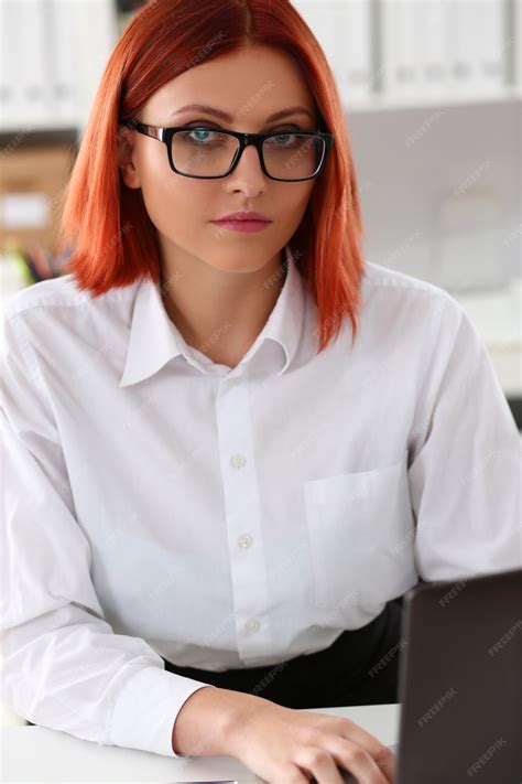 Premium Photo Red Haired Business Woman Sitting At Office Workplce
