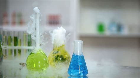 multicolored chemical liquids in flasks bubbling and emitting smoke