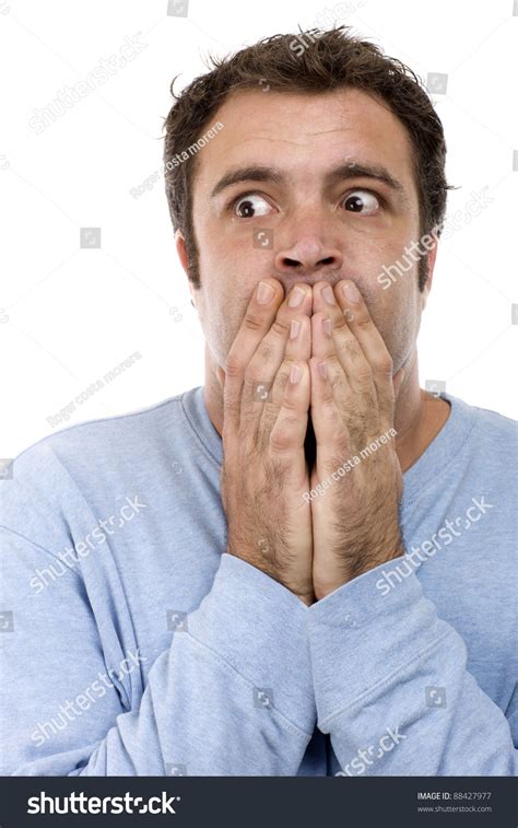 Man Covering His Mouth With His Hands And Looking To One Side Face Of