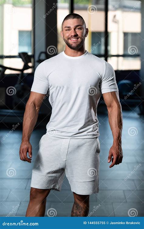 Muscular Man Posing In White T Shirt Stock Image Image Of Person