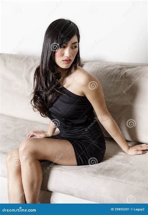 Asian Woman On A Couch Stock Image Image 29855201