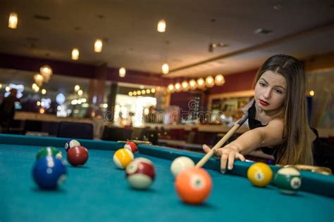 Young And Beautiful Woman In Pub Playing Billiard Stock Image Image