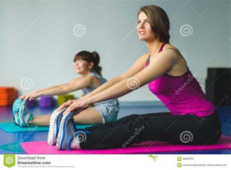 Instructor Or Mother With Daughter Doing Gymnastic Exercises Stock